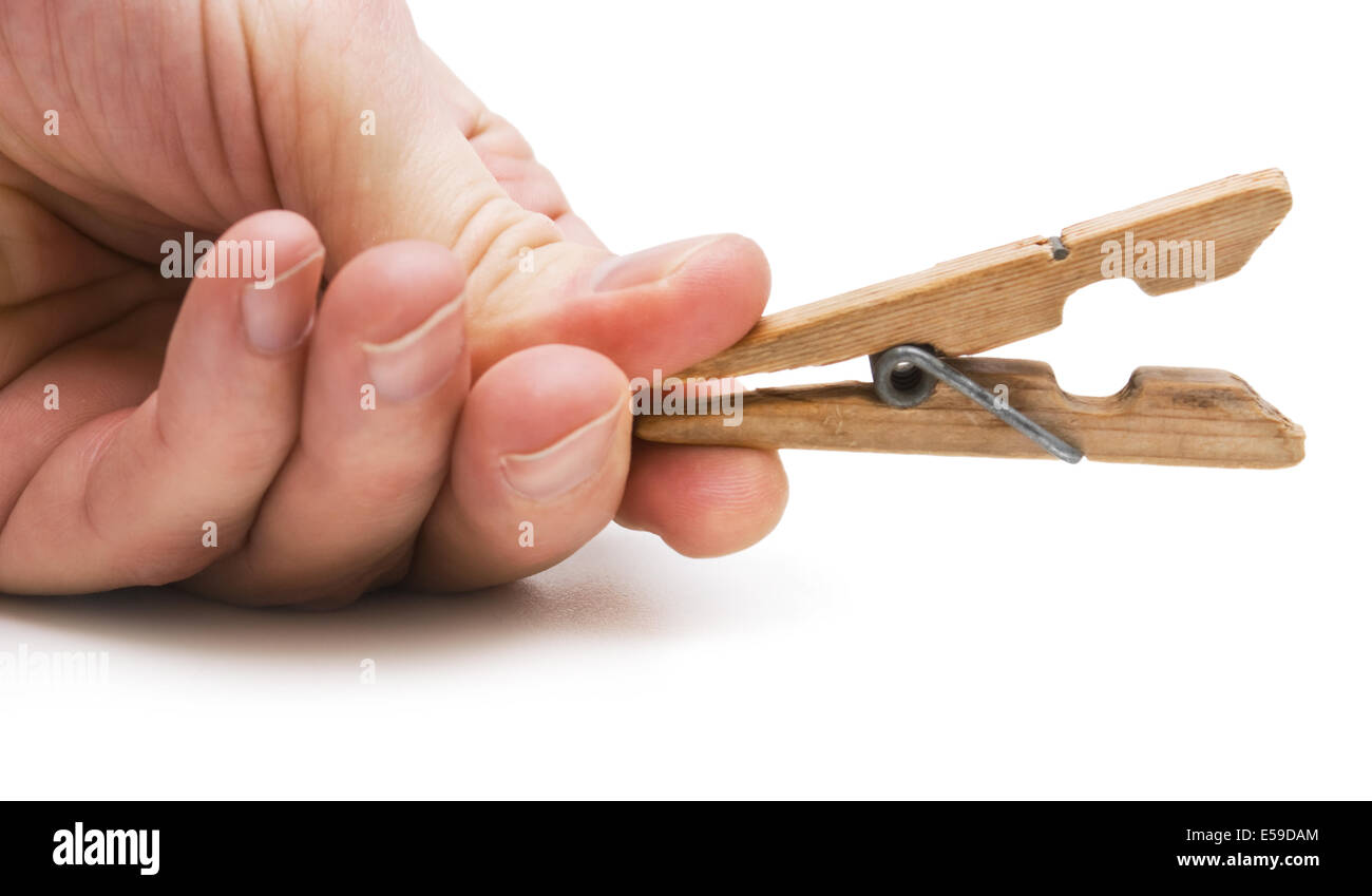 hand holds the clothespin isolated on a white background Stock Photo ...