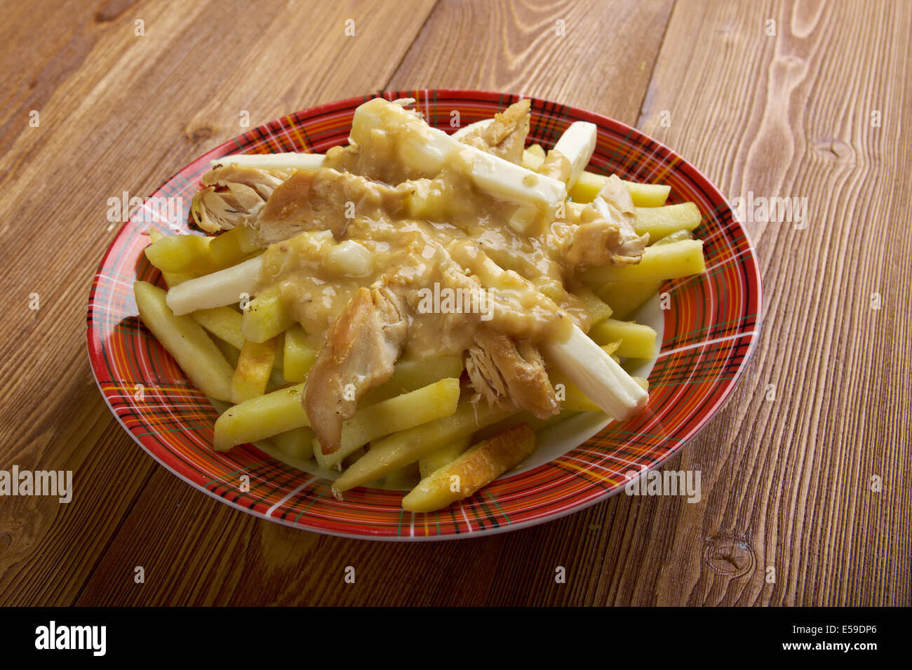 Poutine - common Canadian dish, originally from Quebec, made with ...