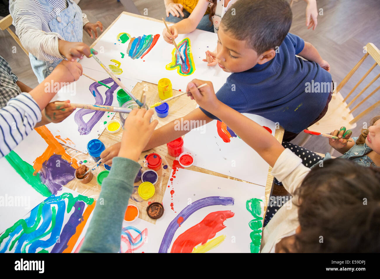 Children painting in class Stock Photo - Alamy