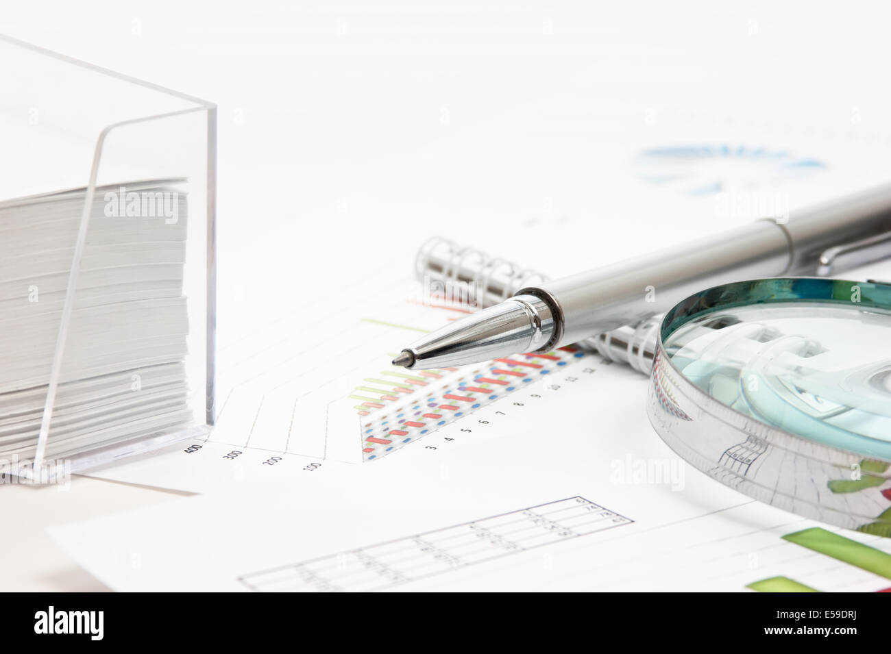 pen, magnifying glass and the working paper with a diagram Stock Photo ...