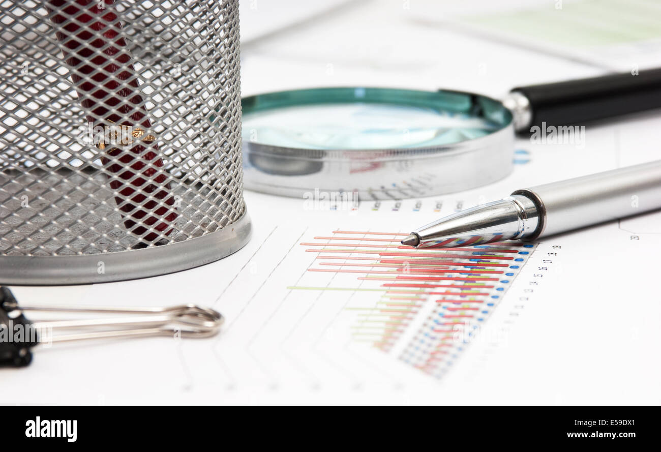 pen, magnifying glass and the working paper with a diagram Stock Photo ...