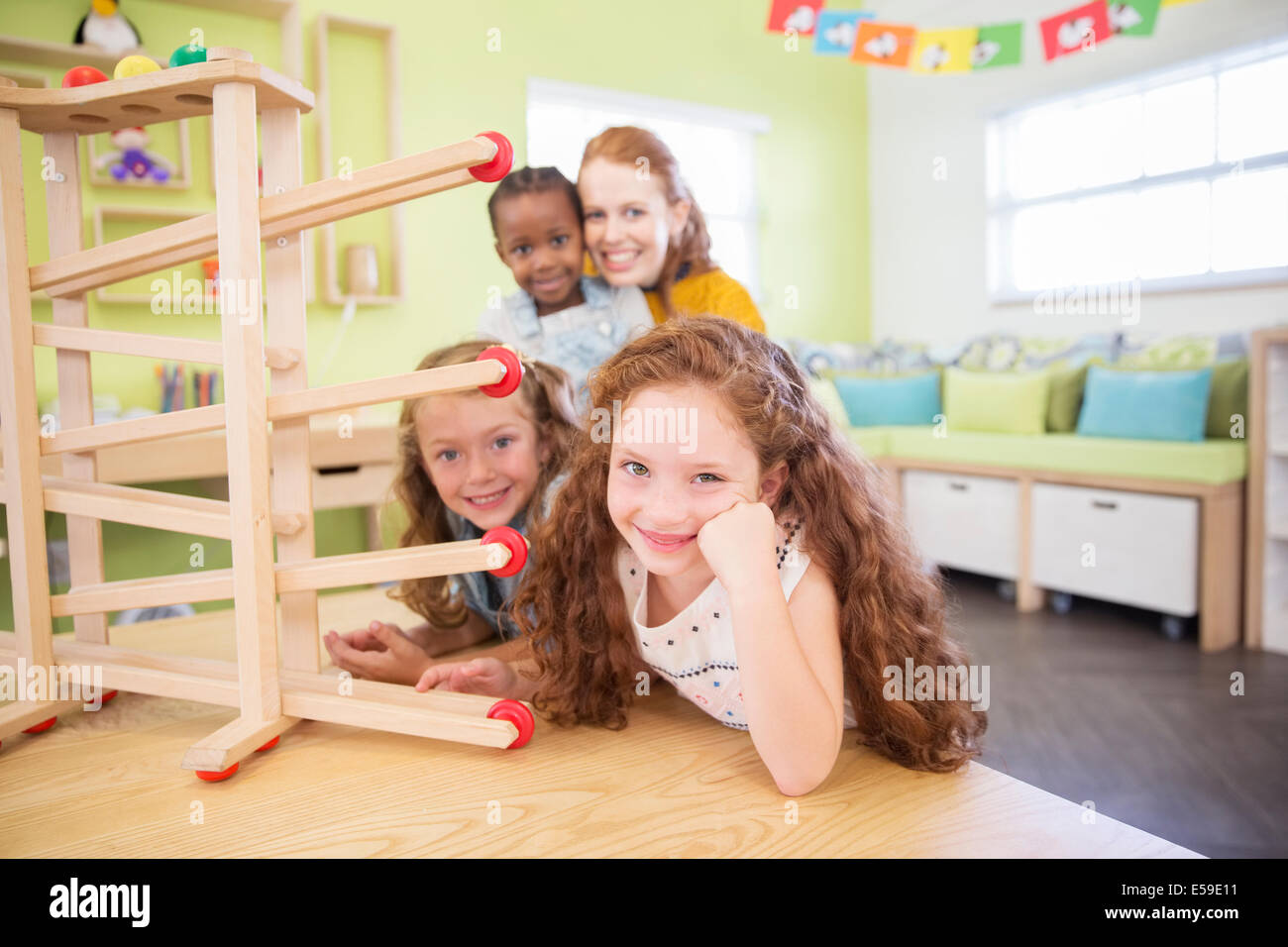Students and teacher using model in classroom Stock Photo - Alamy