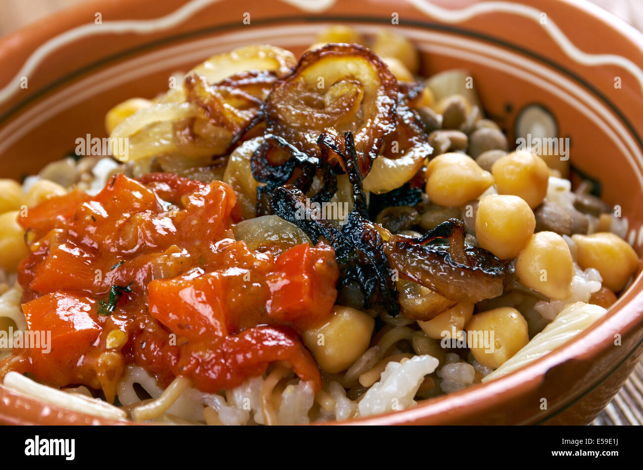 Kushari - is an Egyptian dish of rice, macaroni and lentils mixed ...