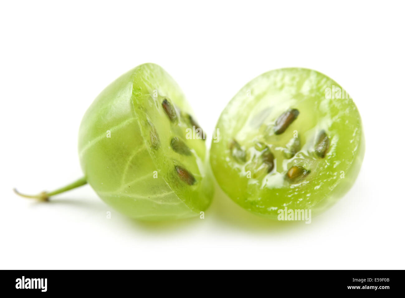 sliced gooseberry isolated on white background Stock Photo - Alamy