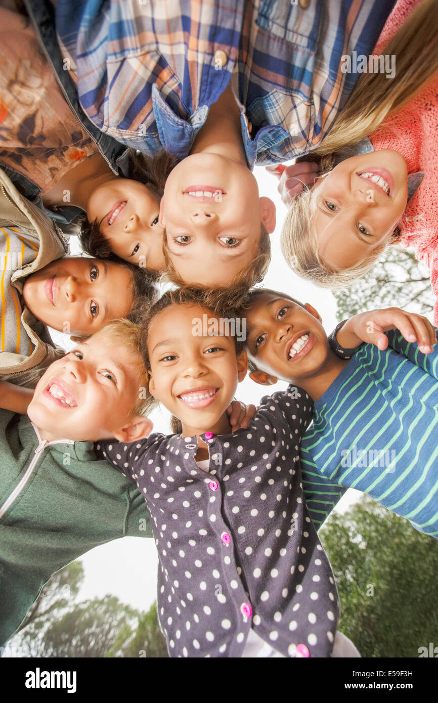 Children huddled together outdoors Stock Photo - Alamy