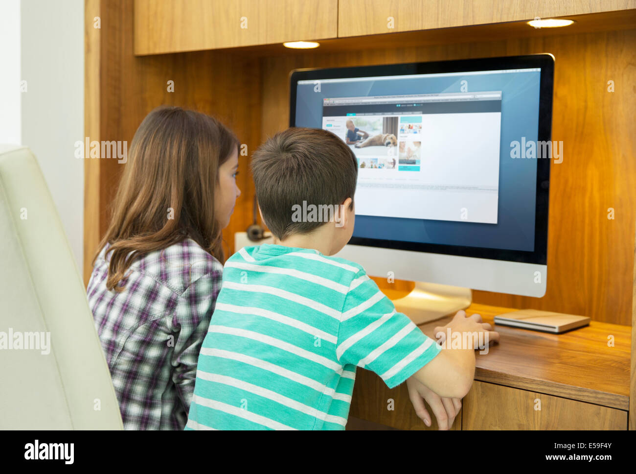 Children using computer together Stock Photo - Alamy