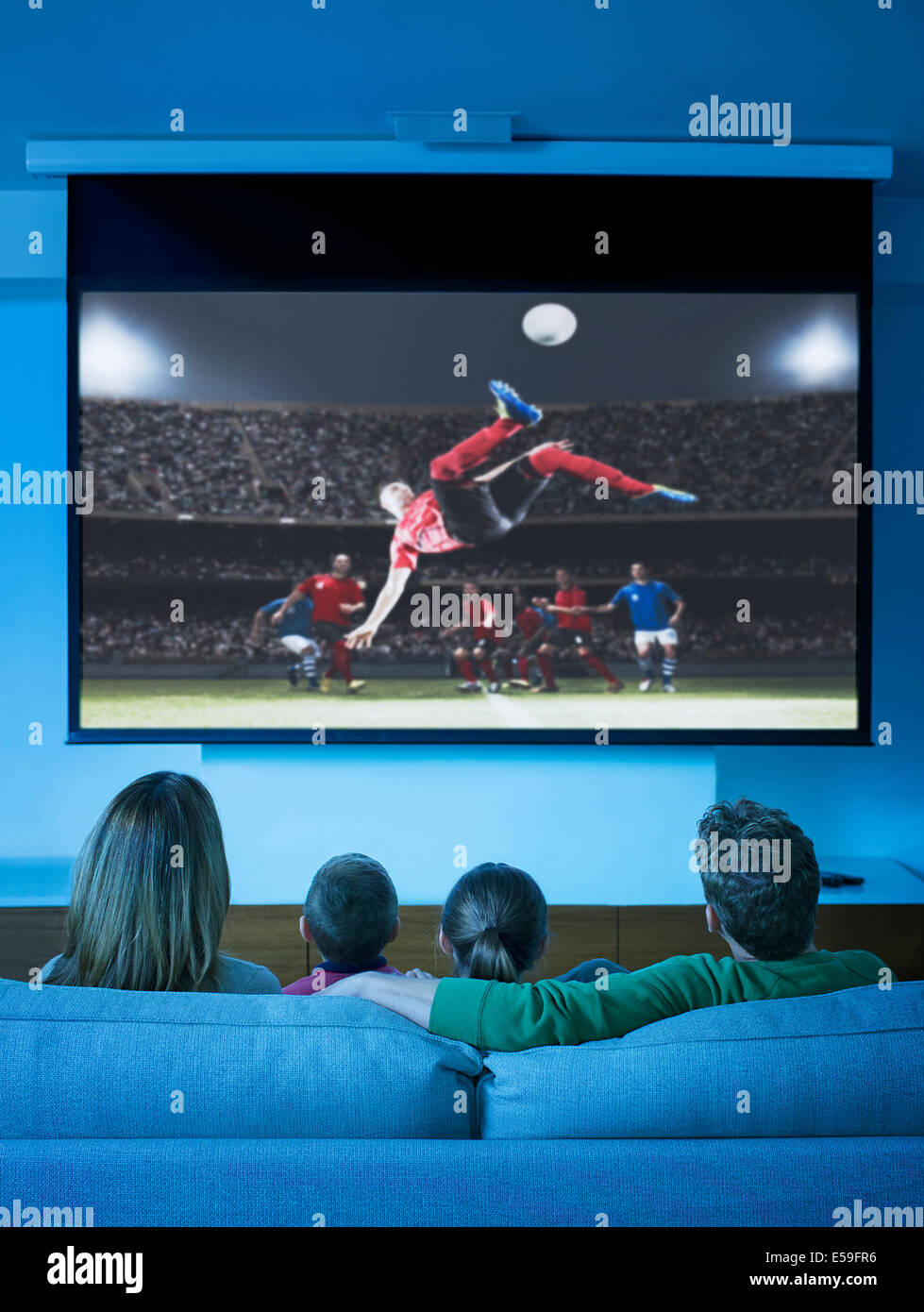 Family watching big screen tv hi-res stock photography and images - Alamy