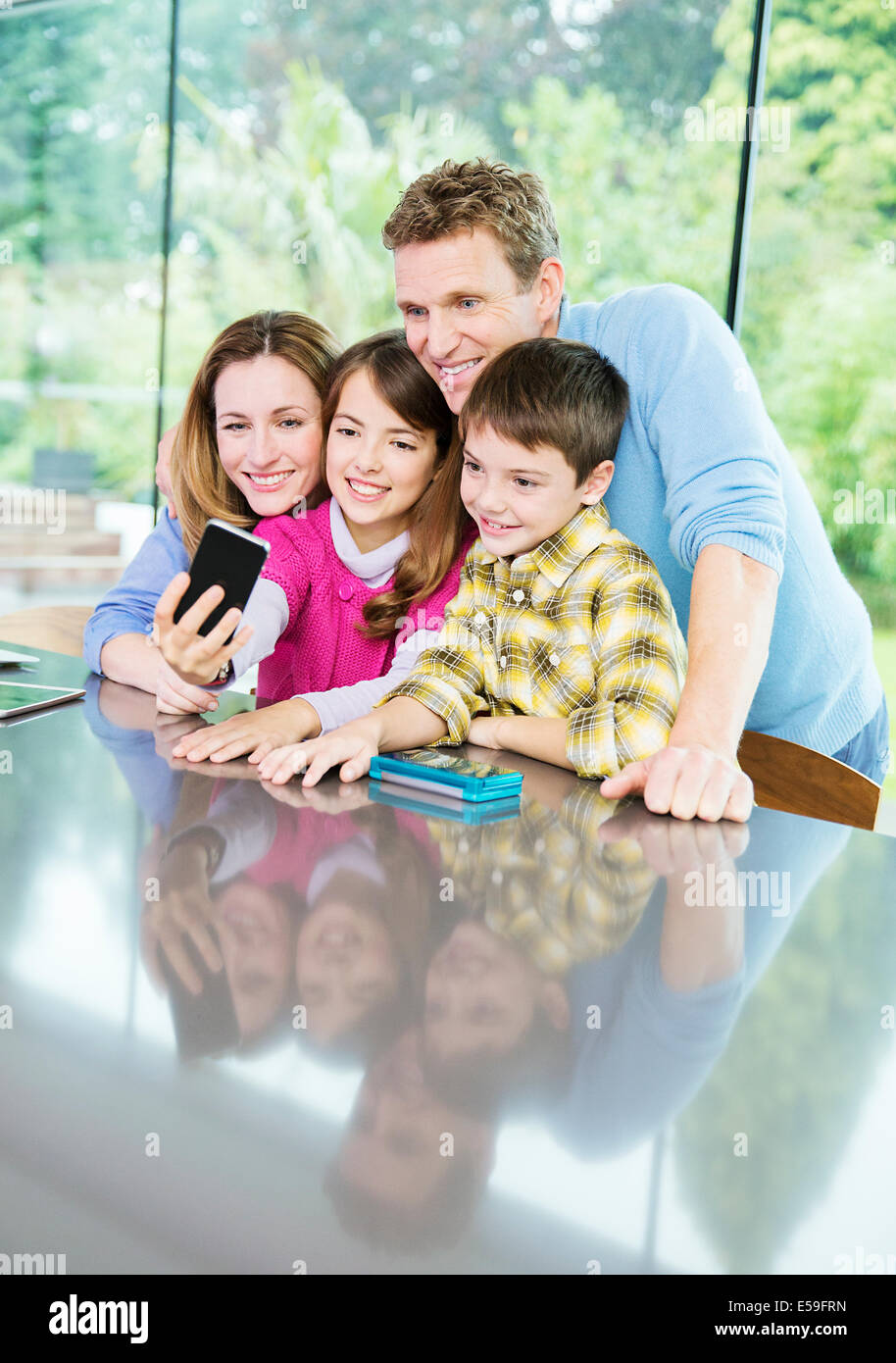 Family taking cell phone picture together Stock Photo - Alamy