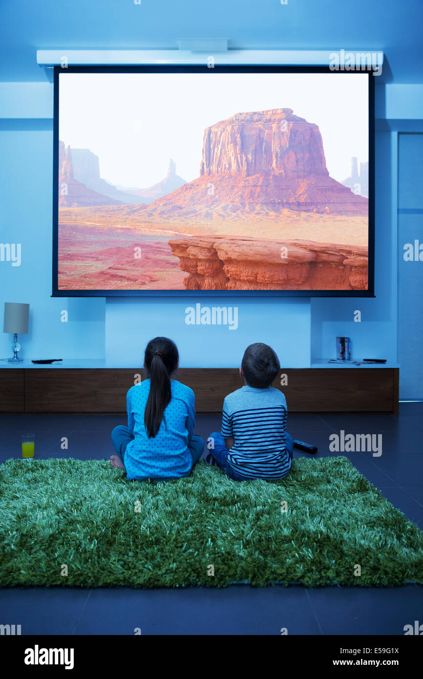 Children watching television in living room Stock Photo - Alamy