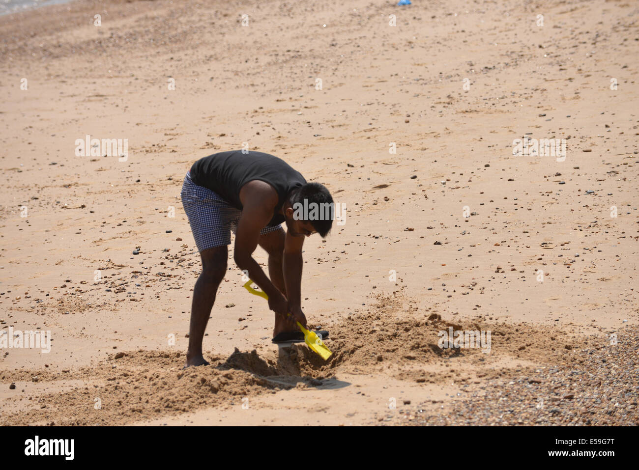 Playing dig digging hole hi-res stock photography and images - Alamy