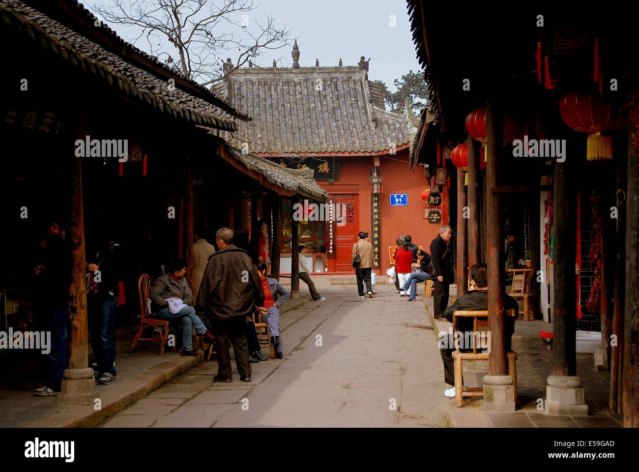 Huang Long Xi, China: Centuries-old wooden houses line a small street ...