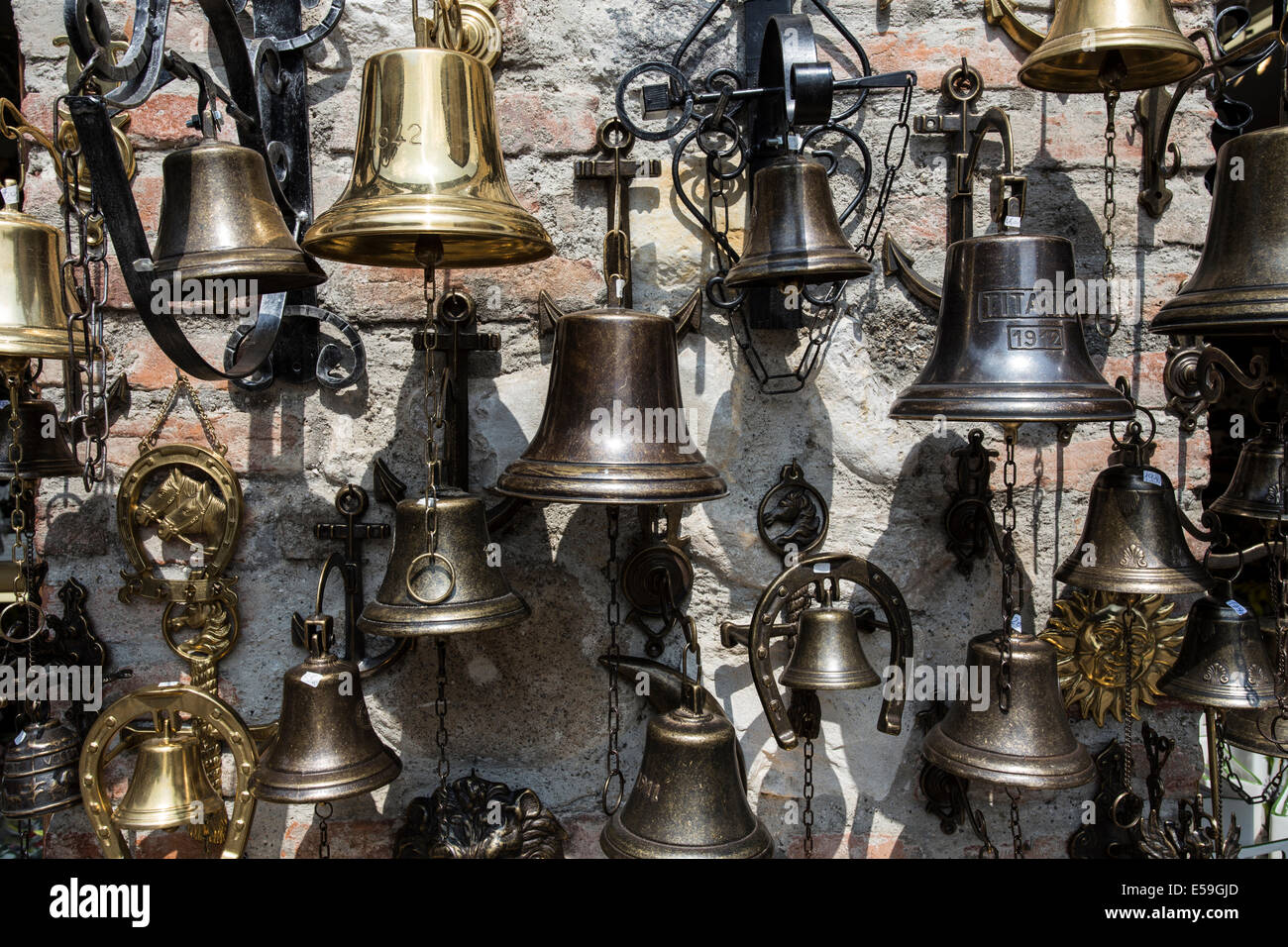 Bells for sale outside store in Italy Stock Photo - Alamy