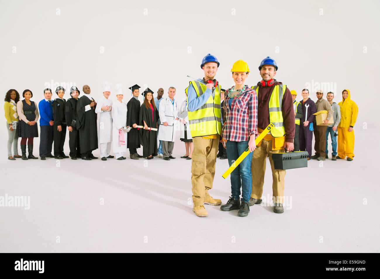 Portrait of construction workers in front of workforce Stock Photo - Alamy