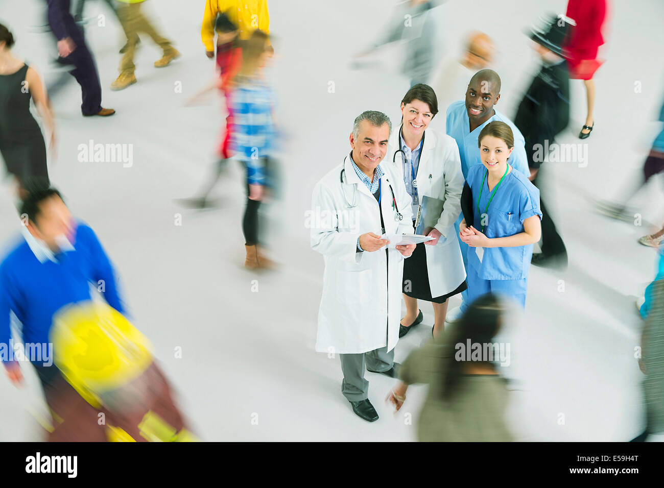 Portrait of confident doctors and nurses among crowd Stock Photo - Alamy