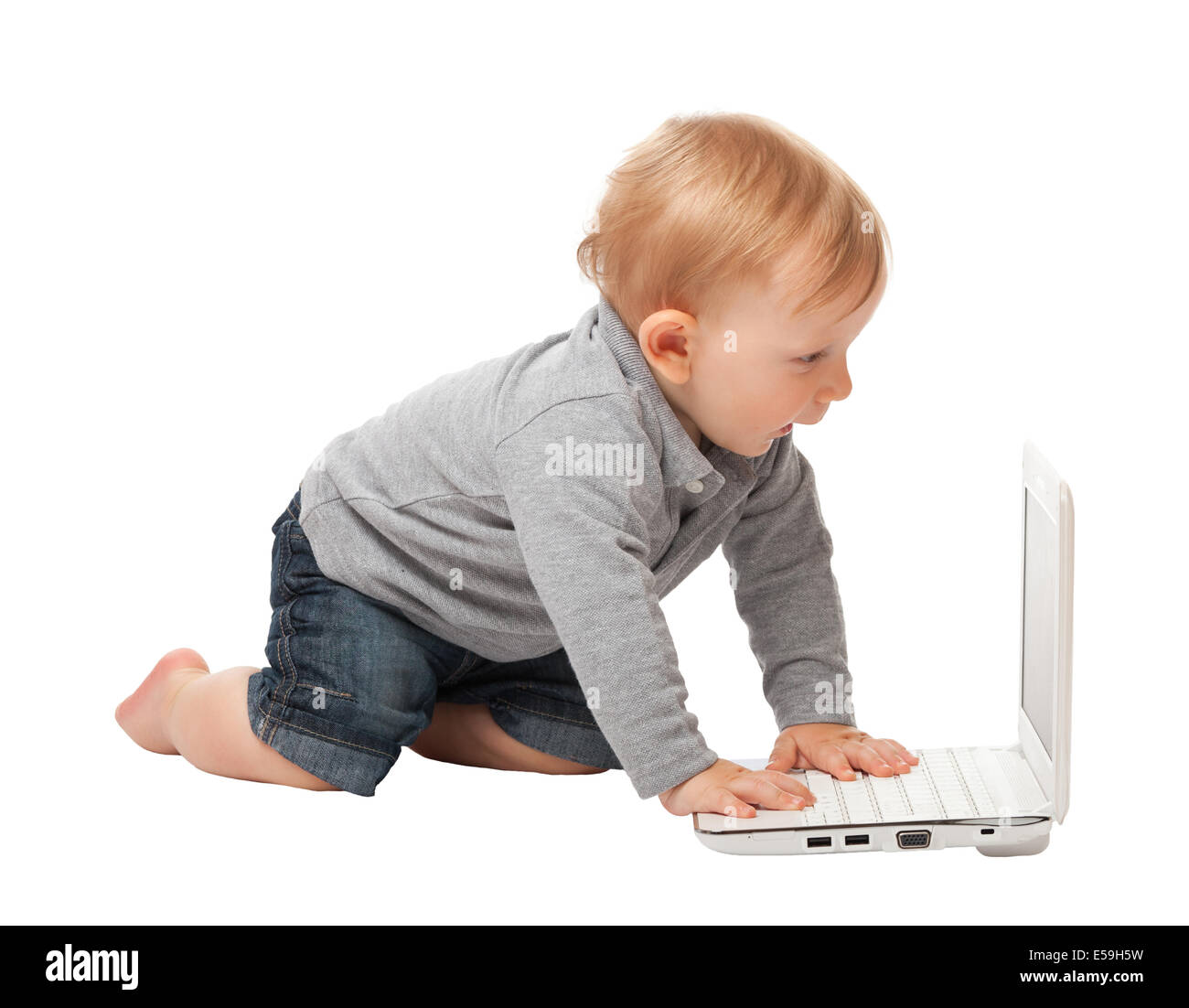 isolated little kid use notebook Stock Photo - Alamy