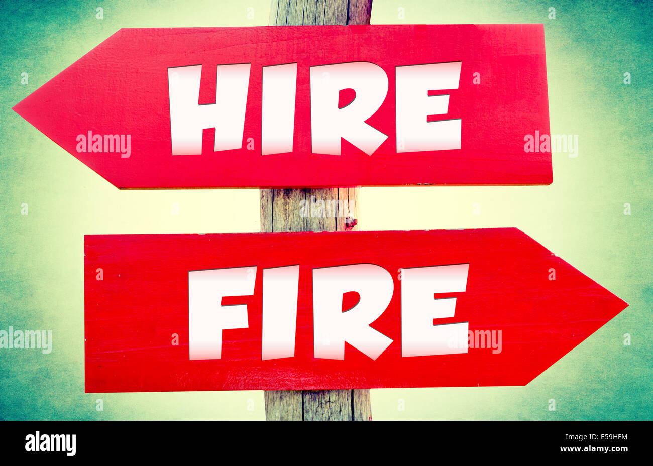 Hire and fire concept on the red signs with landscape in background ...