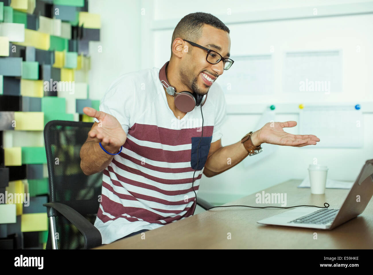 Young adult man laptop hi-res stock photography and images - Alamy