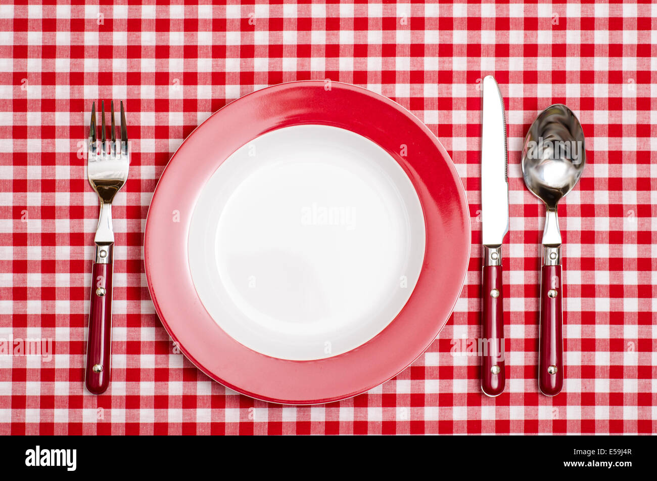 Red place setting with red checkered table cloth in a restaurant Stock ...