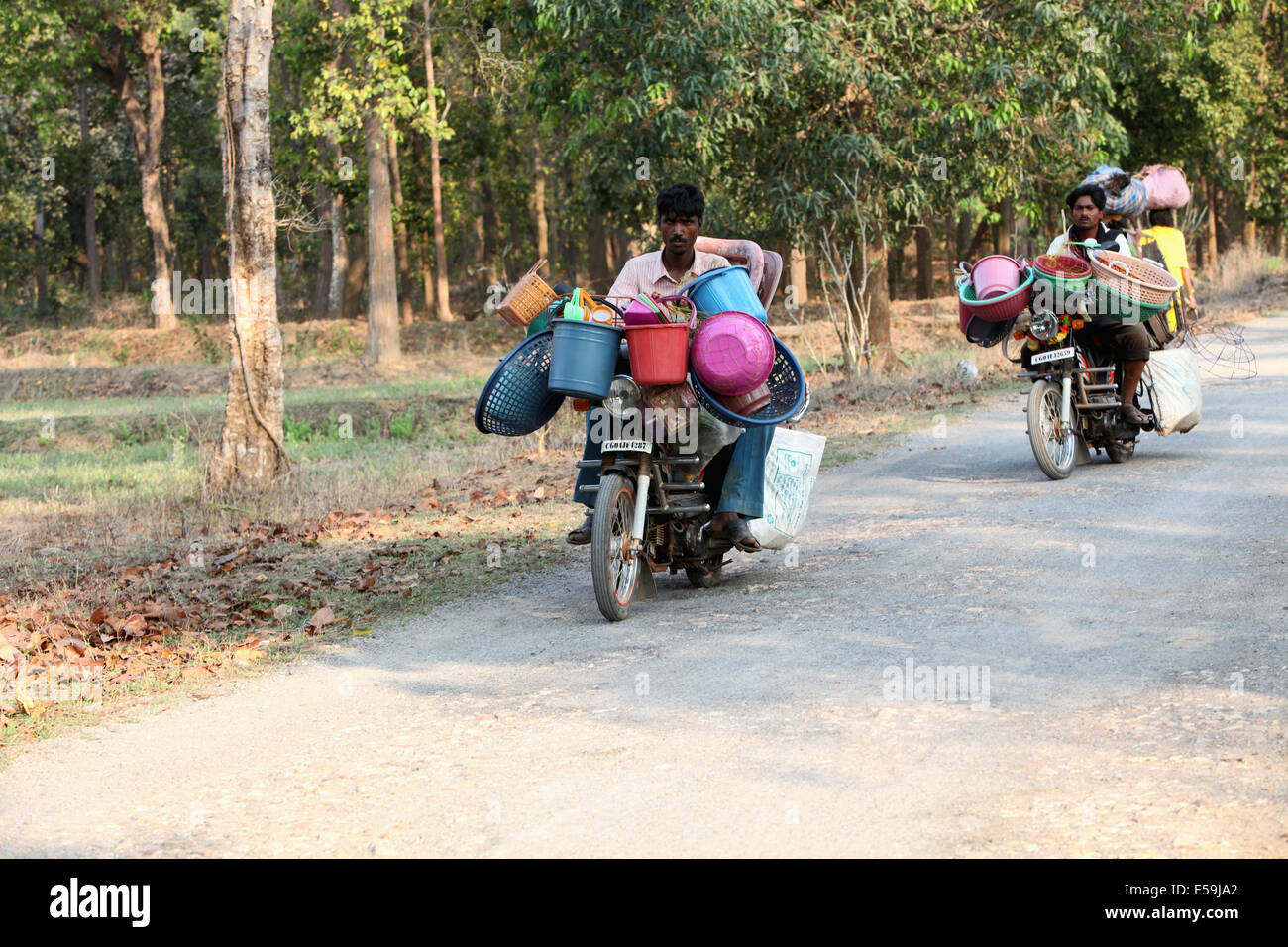 A man carrying goods on a motor cycle, Kodopali Village, Chattisgadh ...