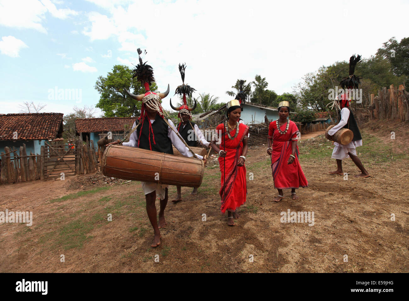 Tribal peolpe performing a typical tribal dance in traditional outfits ...