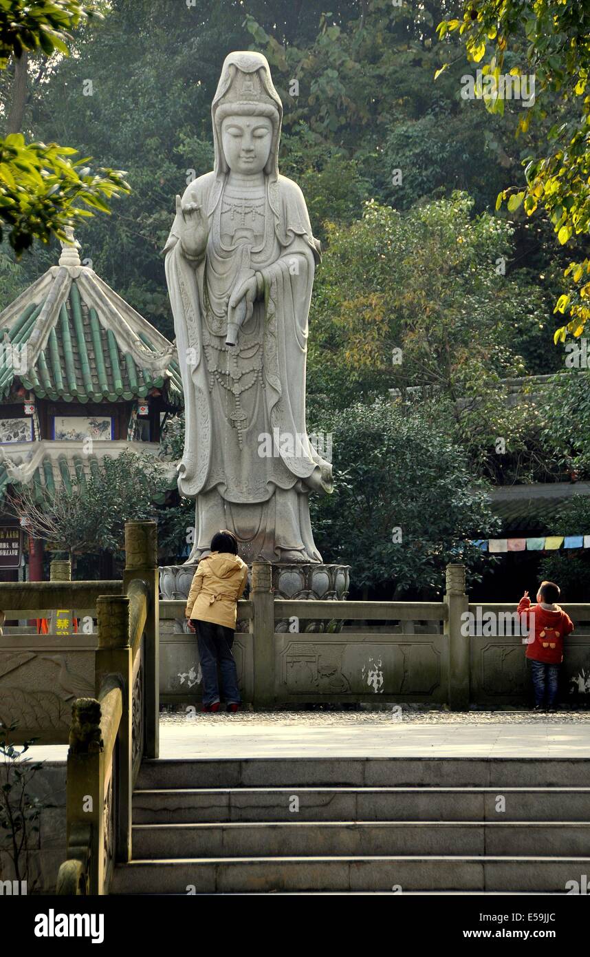 DAN JING SHAN TOWN (SICHUAN), CHINA: Two visitors stop to admire the ...