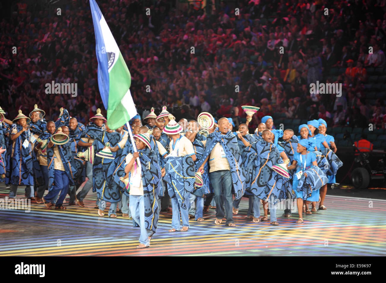 Glasgow, Scotland, UK. 23rd July, 2014. Athletes from Lesotho being led ...