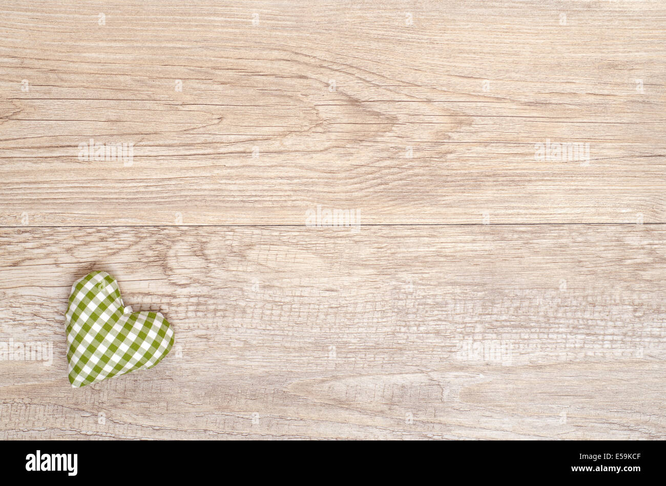 Green checked handmade heart on weathered wooden board Stock Photo - Alamy