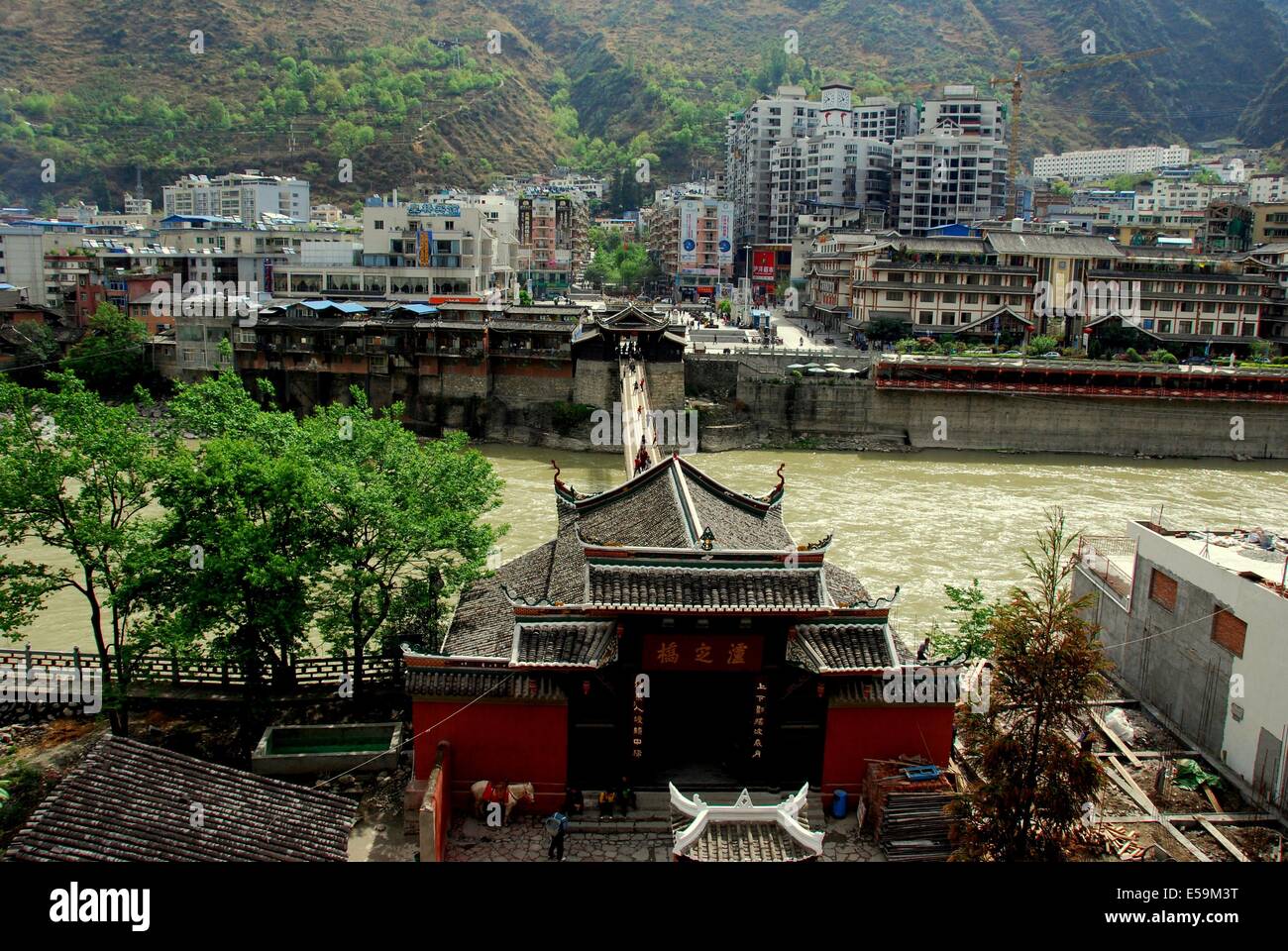 Lu Ding, China: The Guan Yin Gu Temple overlooks modern city built on ...