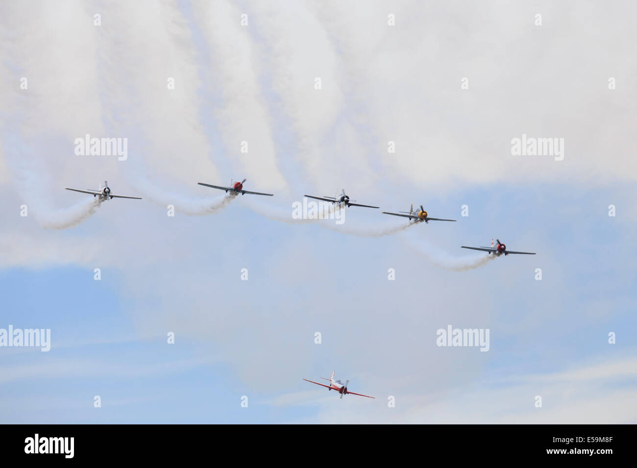 The 'Aerostars' aerobatic team perform at 2014 Farnborough Airshow in ...