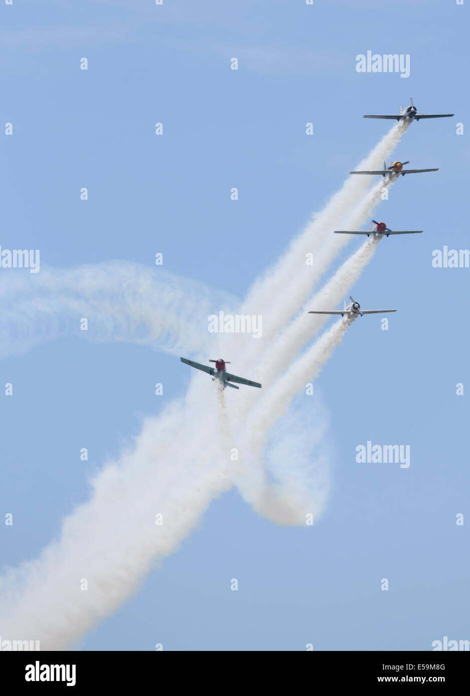 The 'Aerostars' aerobatic team perform at 2014 Farnborough Airshow in ...
