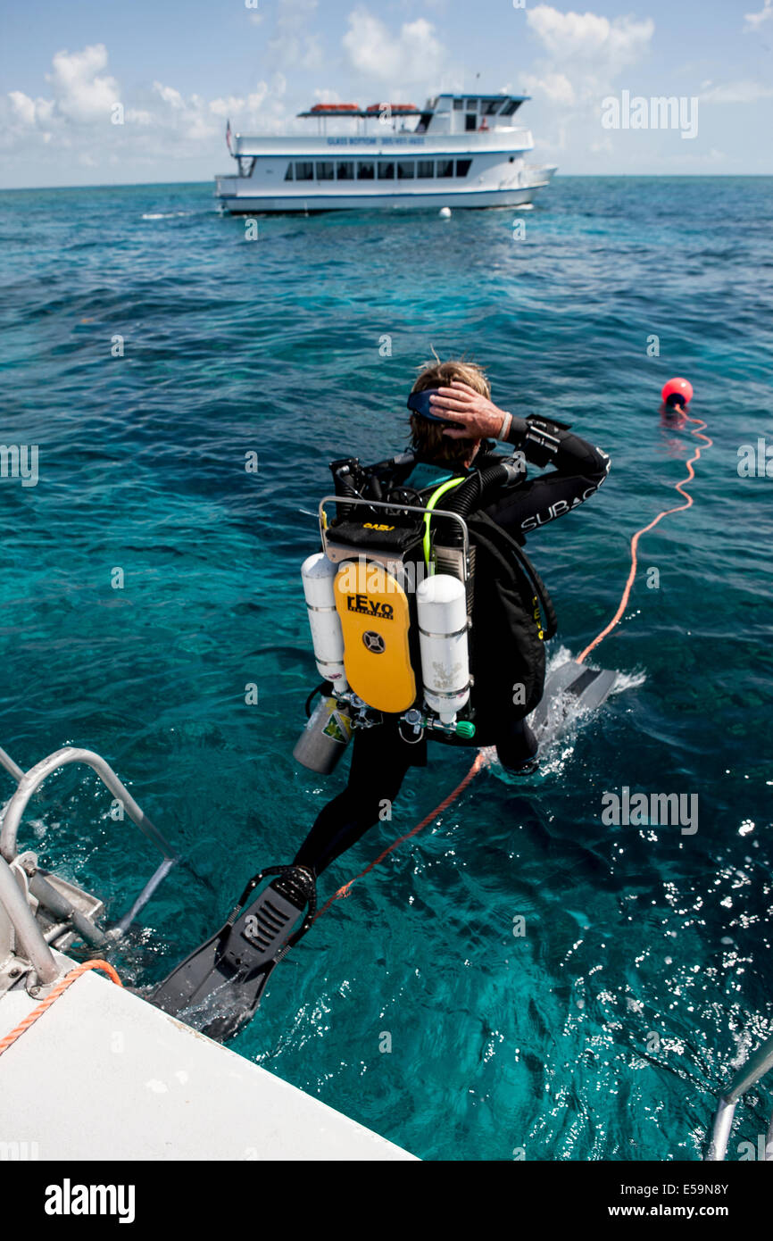 Technical diver performs giant stride Stock Photo - Alamy