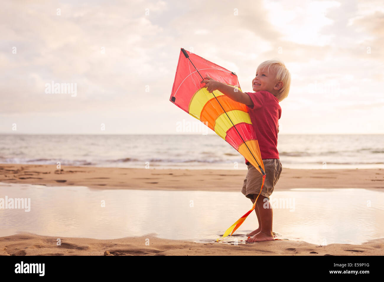 Boy kite flying sunset hi-res stock photography and images - Alamy