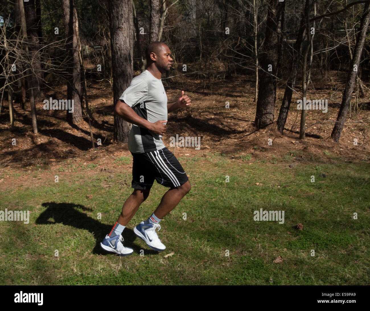 Scuba diver jogging for fitness Stock Photo - Alamy
