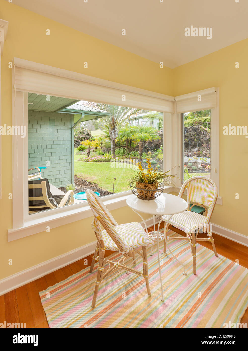 Bright and sunny breakfast table in classic home with wood floors Stock ...