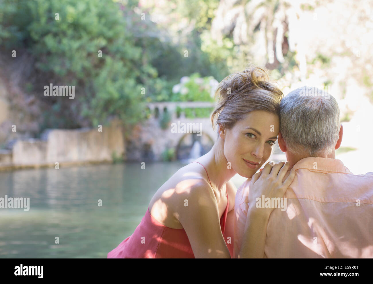 Couple overlooking river and bridge Stock Photo - Alamy
