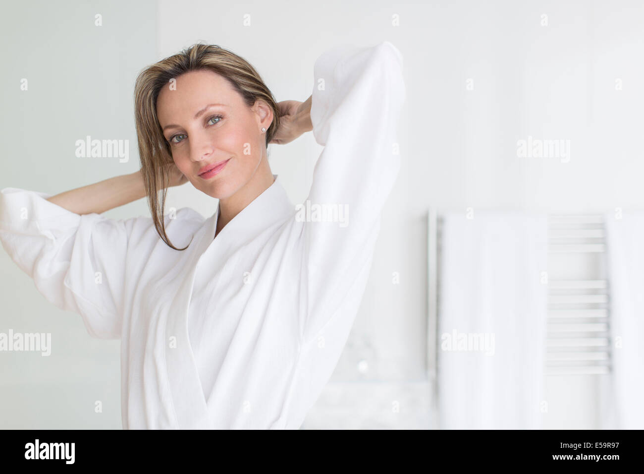 Woman wearing bathroom robe hi-res stock photography and images - Alamy