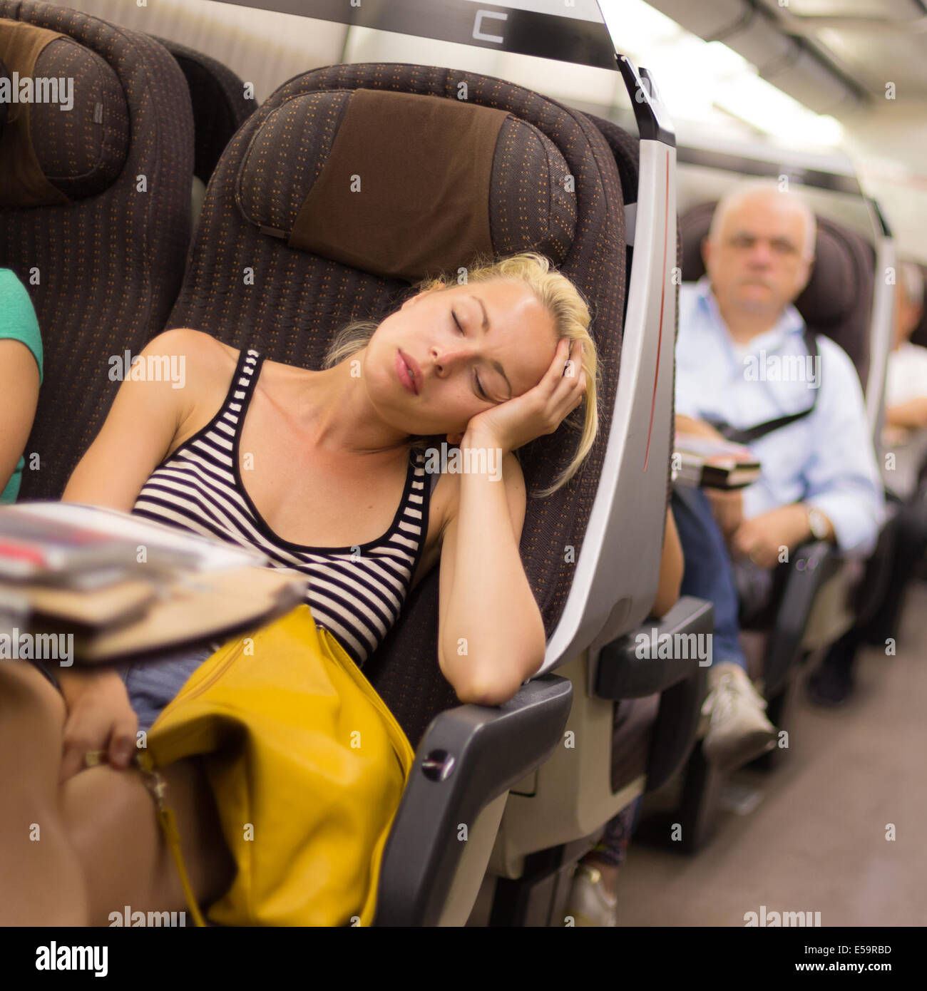 Lady traveling napping on a train Stock Photo - Alamy