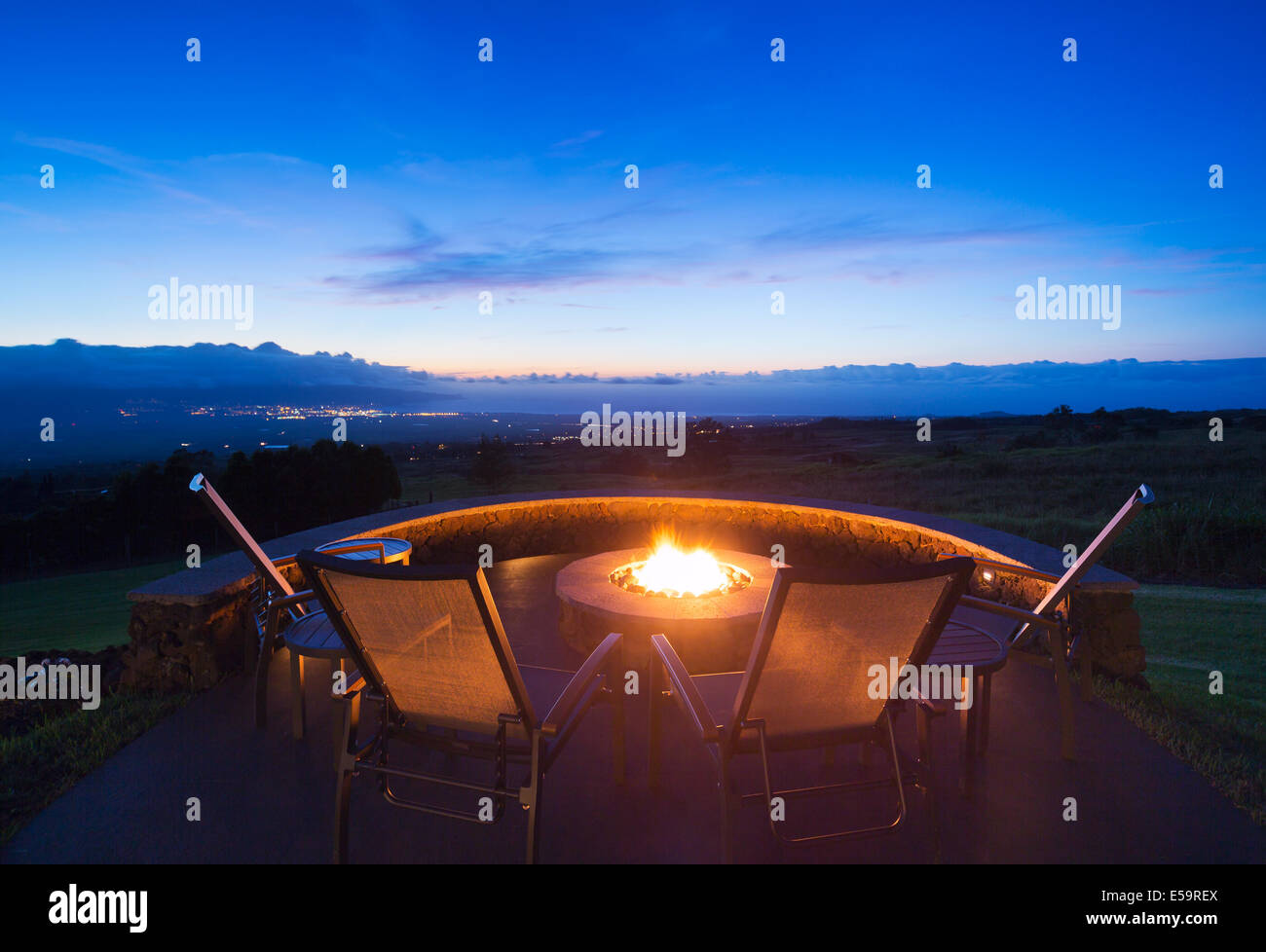 Luxury backyard fire pit at sunset Stock Photo - Alamy