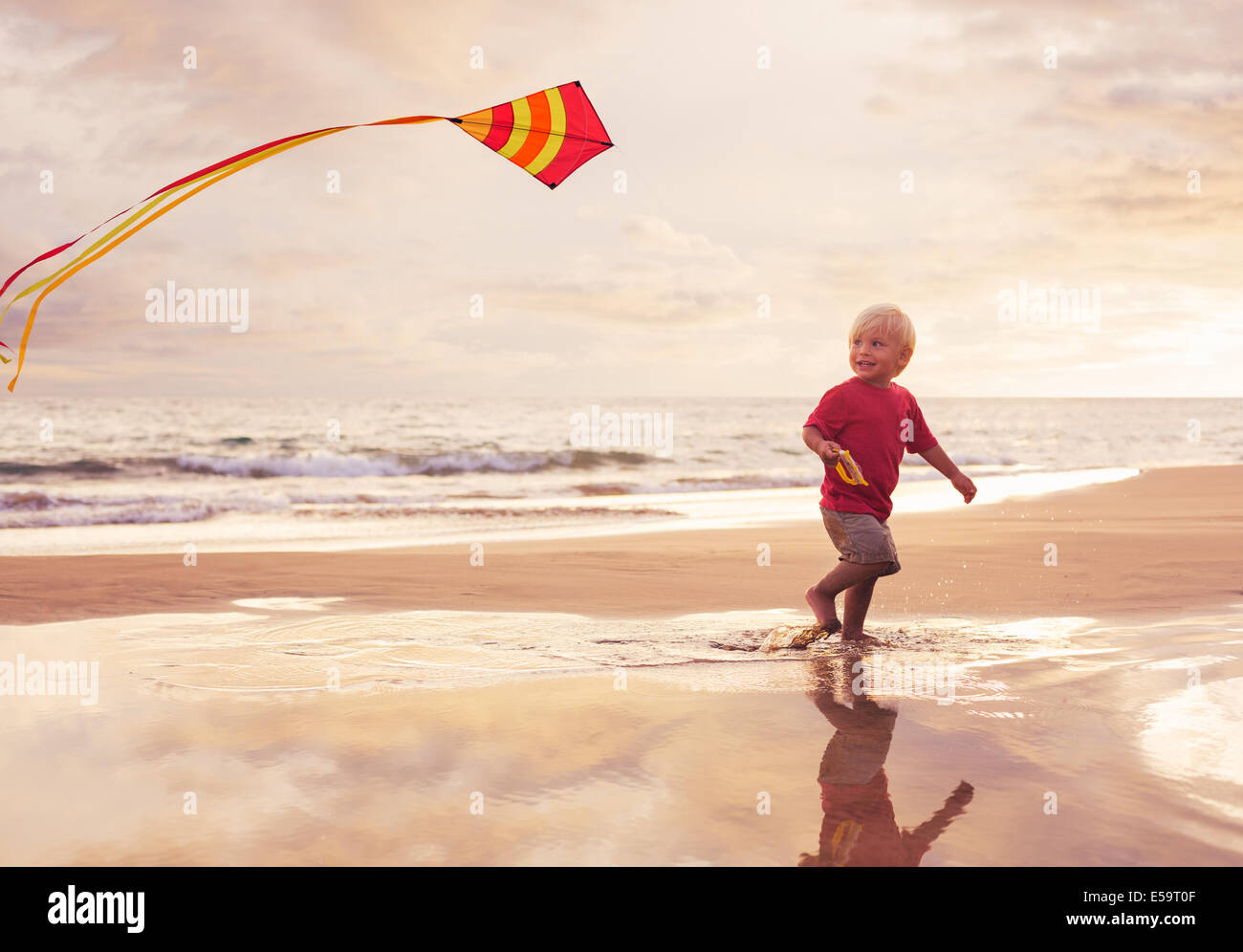 Boy kite flying sunset hi-res stock photography and images - Alamy