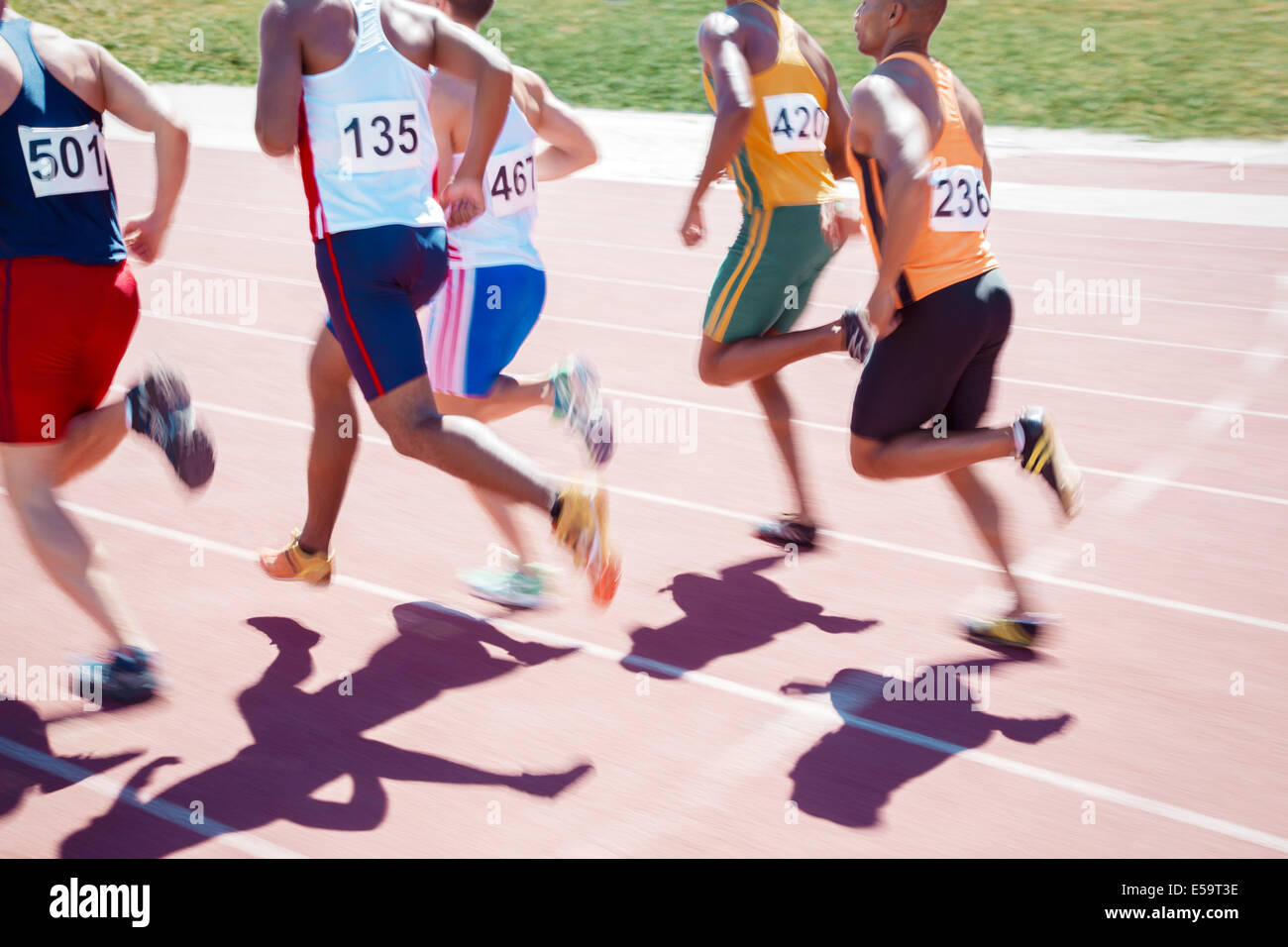 Runners racing on track Stock Photo - Alamy