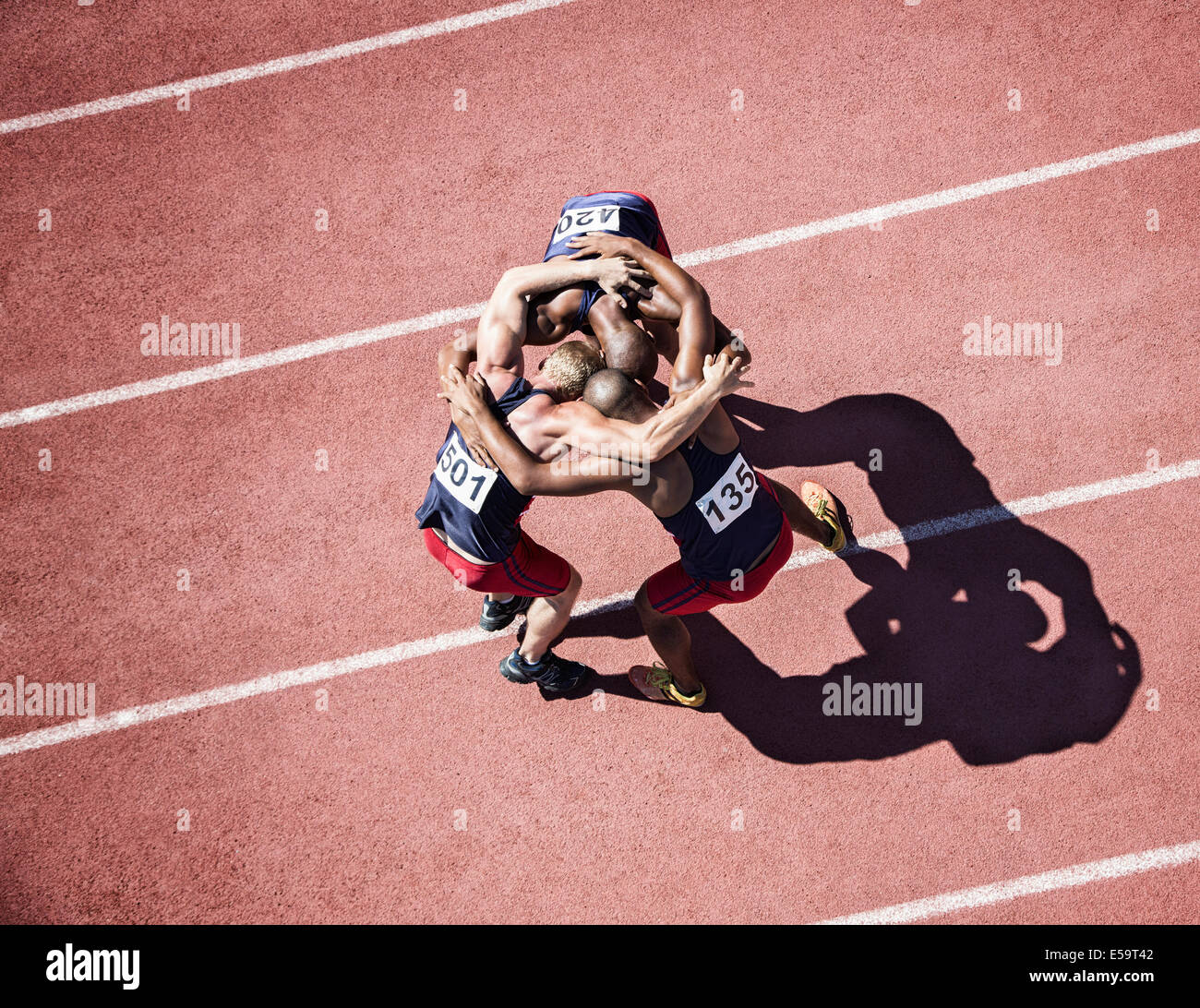 Men huddled around hi-res stock photography and images - Alamy