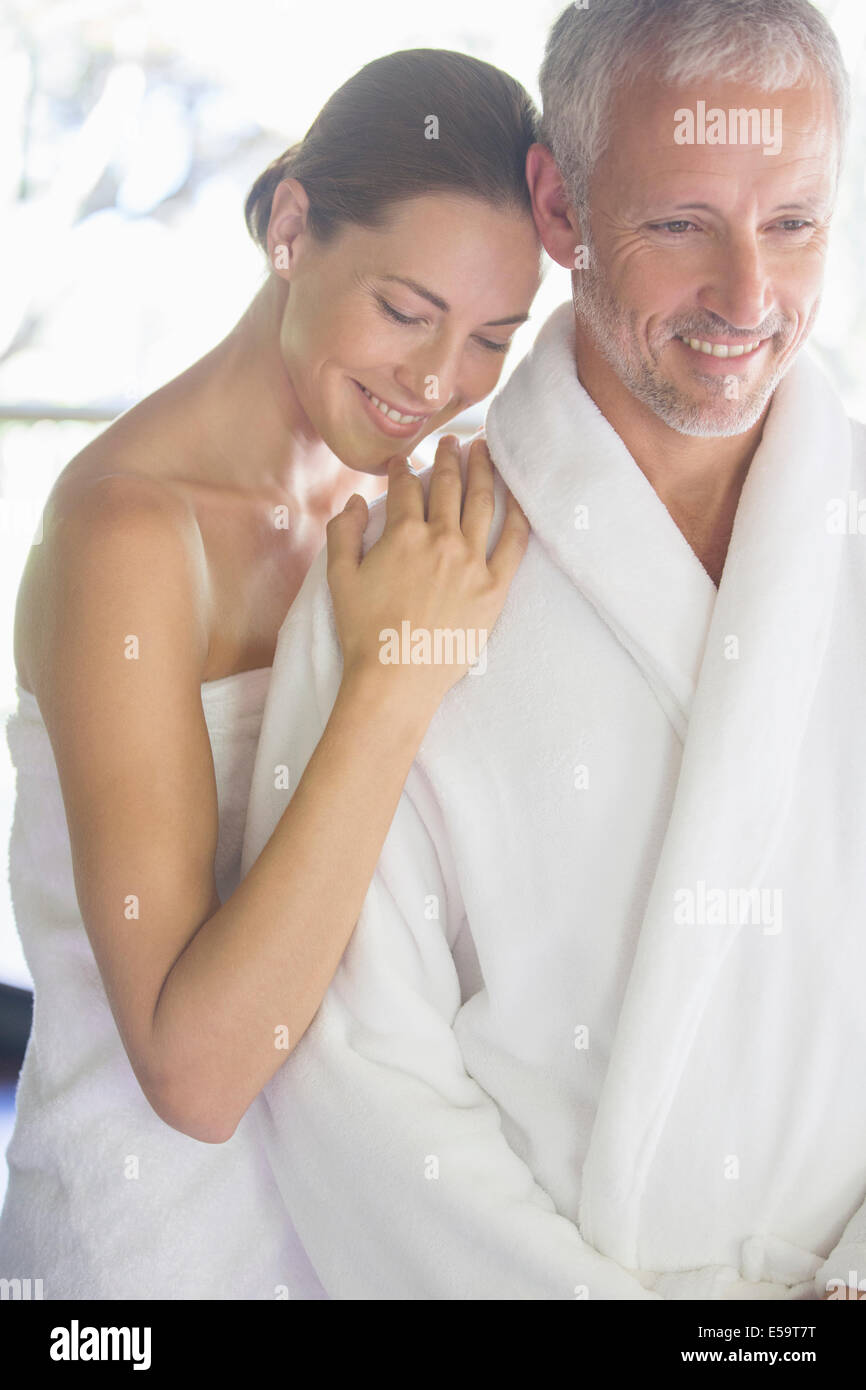 Smiling couple hugging Stock Photo - Alamy
