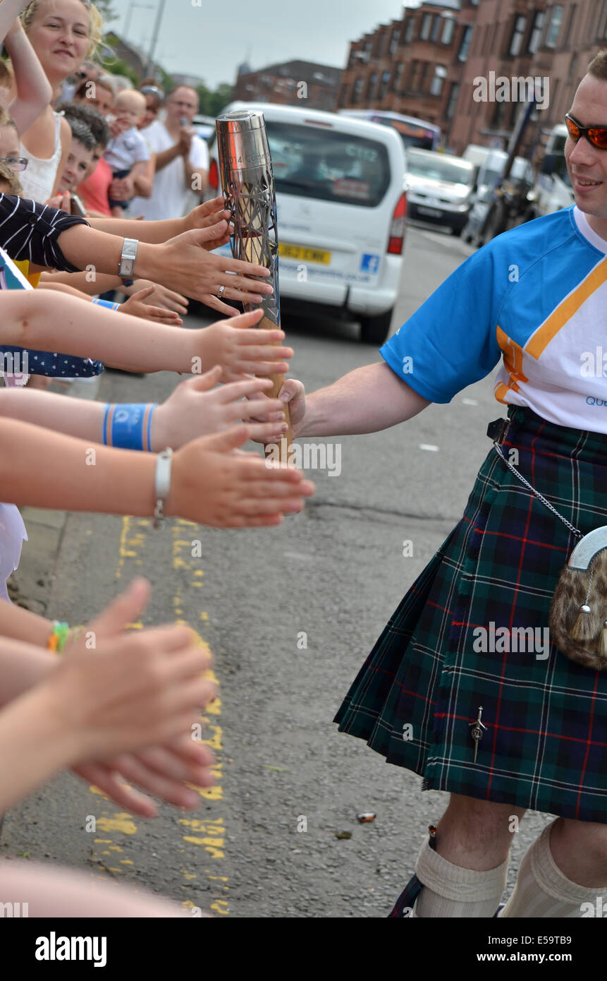 The Queens Baton Relay, the baton being touched by children who had ...
