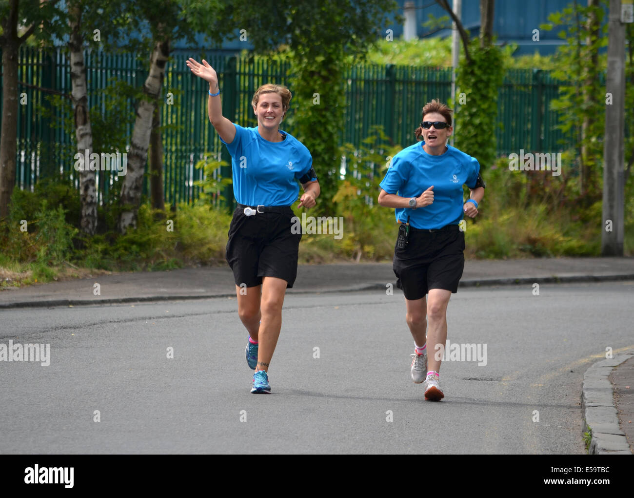Very friendly police runners at the Queen's Baton Relay, running down ...