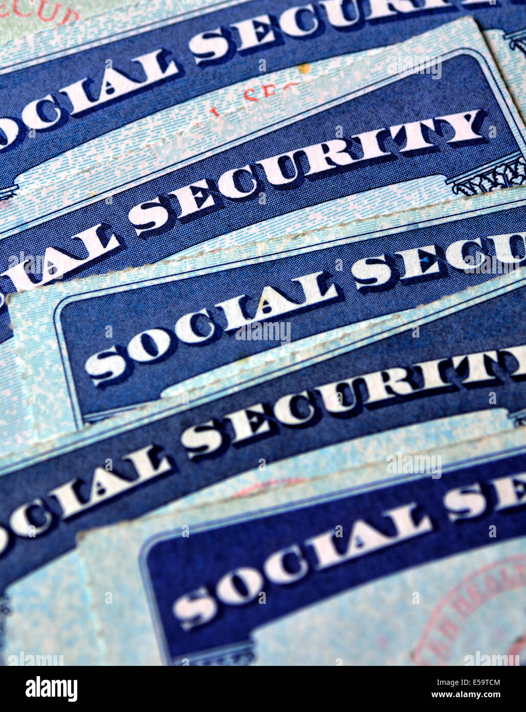 Closeup detail of several Social Security Cards representing finances ...
