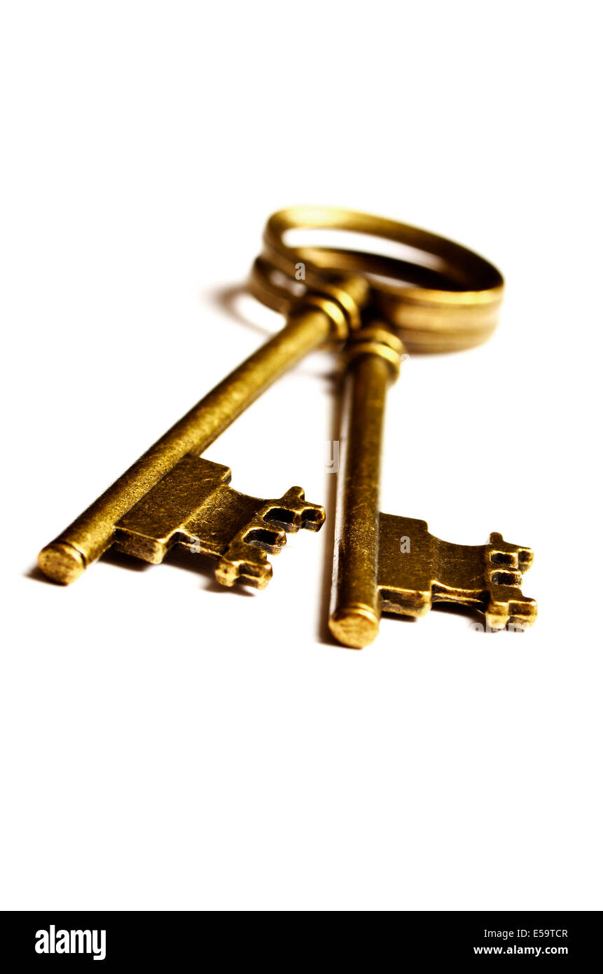 Old keys laying on top of white background isolated Stock Photo - Alamy