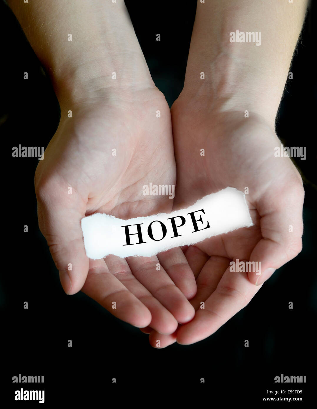Person hands holding cupping paper message for Hope Stock Photo - Alamy