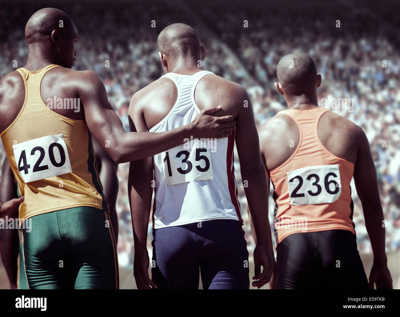 Runner comforting teammate Stock Photo - Alamy