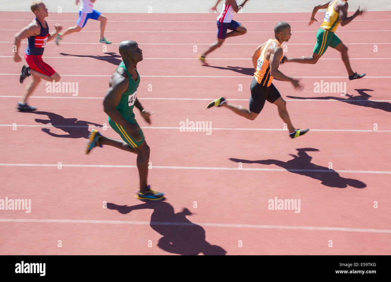 Runners racing on track Stock Photo - Alamy