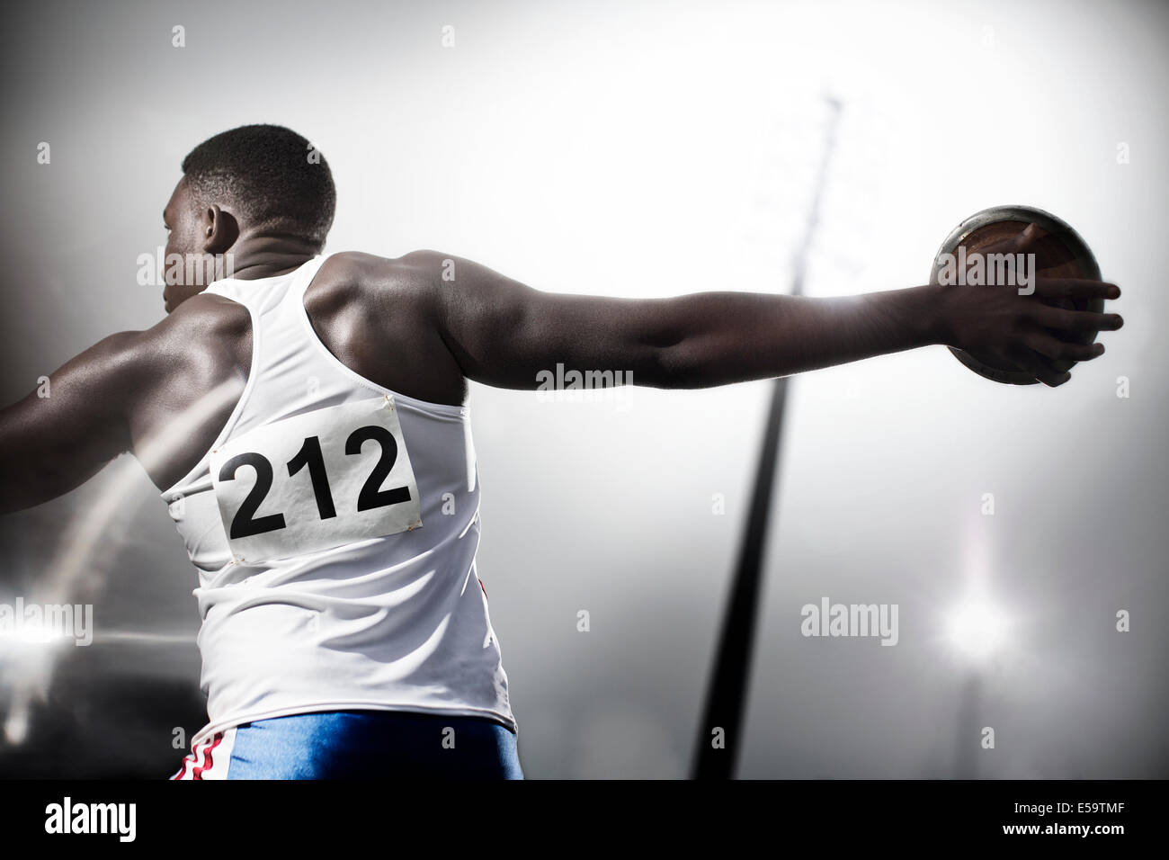 Track and field athlete throwing discus Stock Photo - Alamy